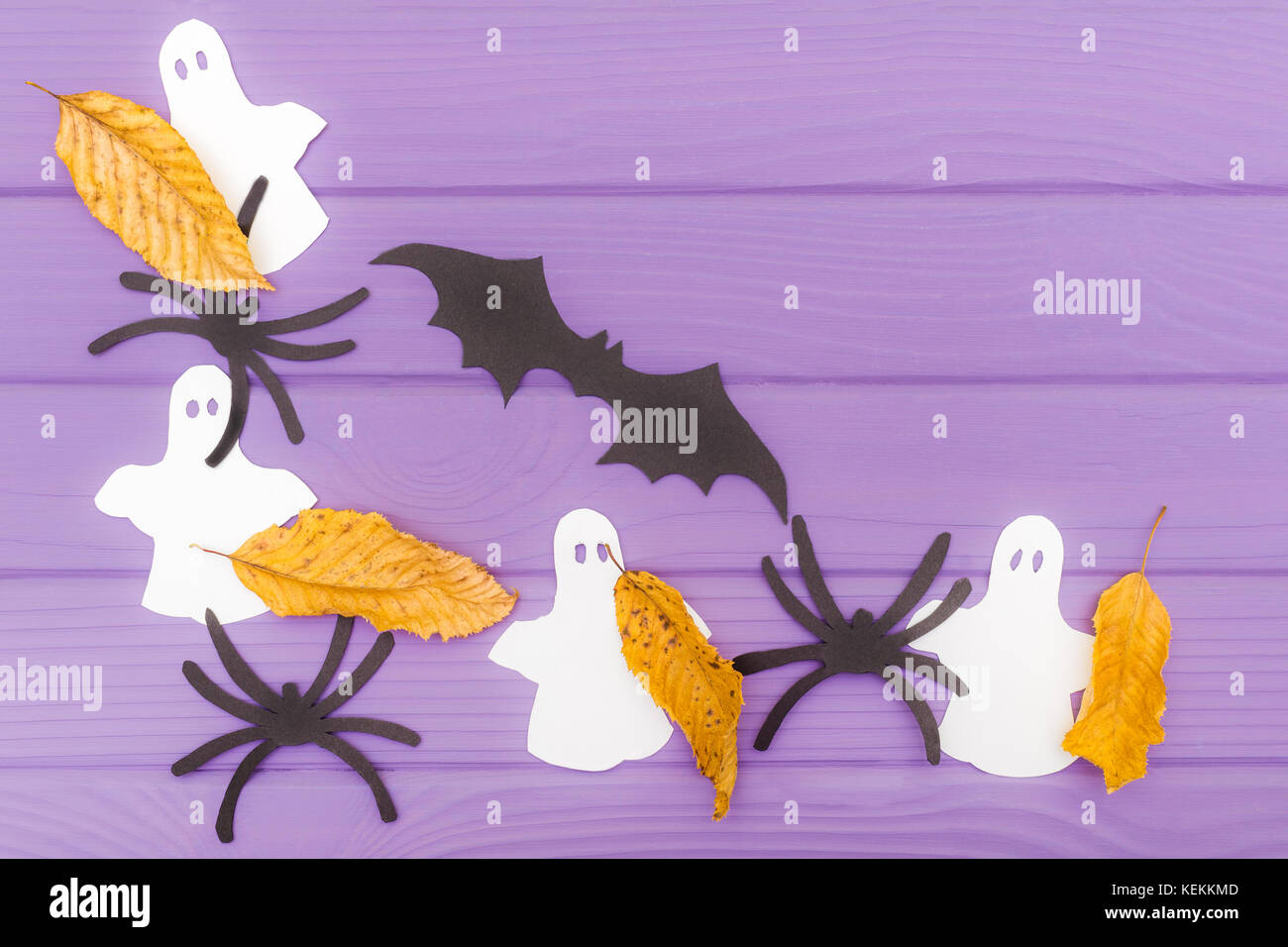 The bat, ghosts and spiders different paper silhouettes with autumn ...