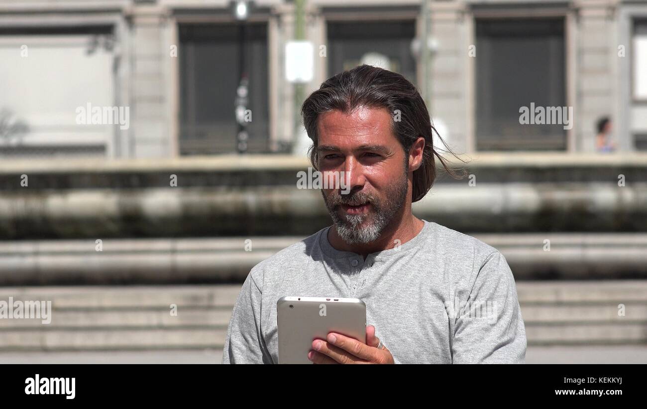 Male Using Tablet Stock Photo - Alamy