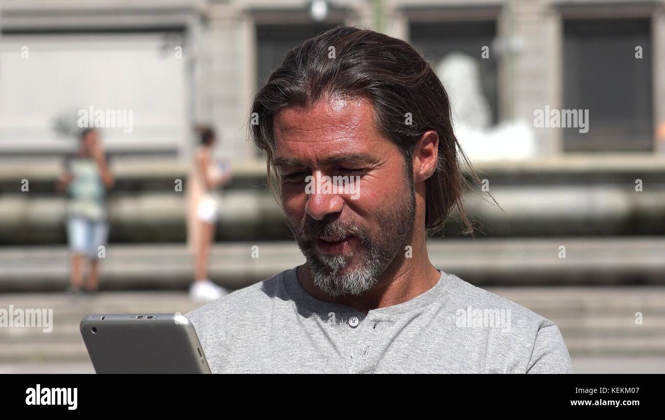 Male Using Tablet Stock Photo - Alamy