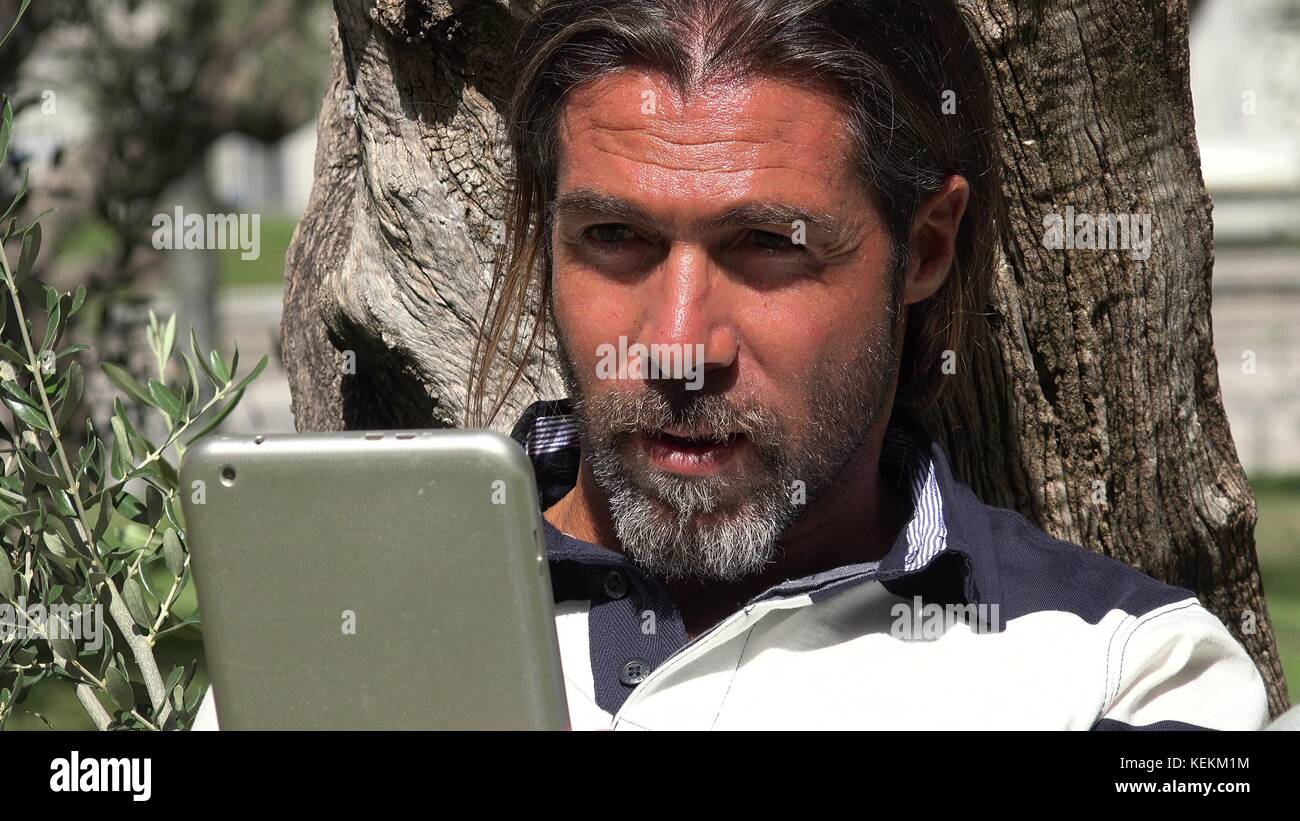 Male Using Tablet Stock Photo - Alamy