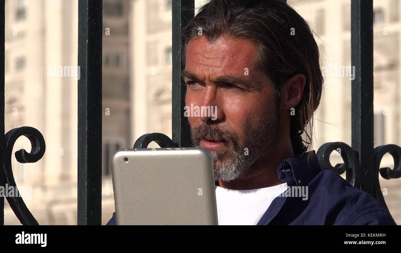 Handsome Male Using Tablet Stock Photo - Alamy