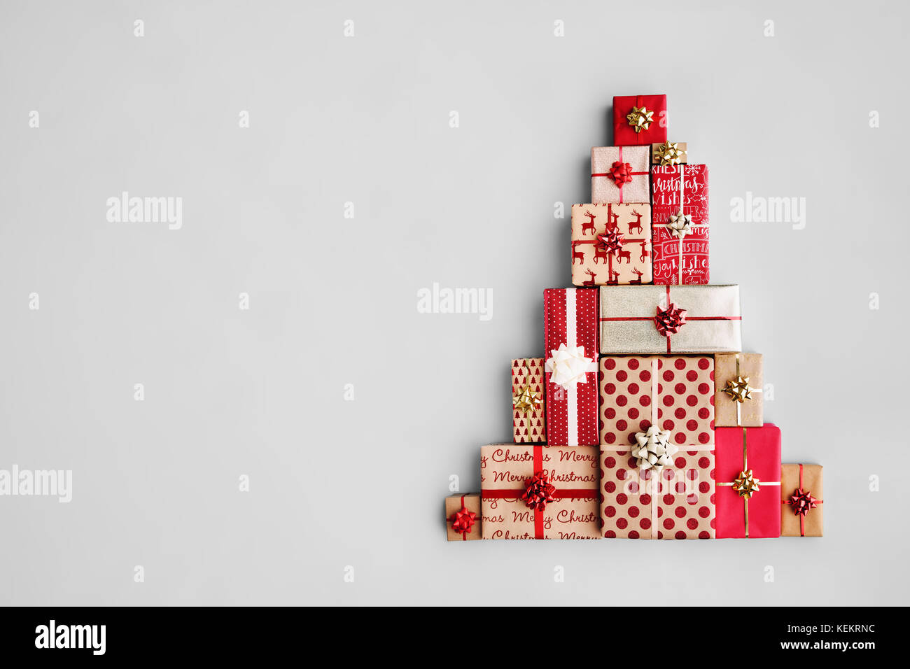 Christmas gift boxes laid out in the shape of a Christmas tree ...