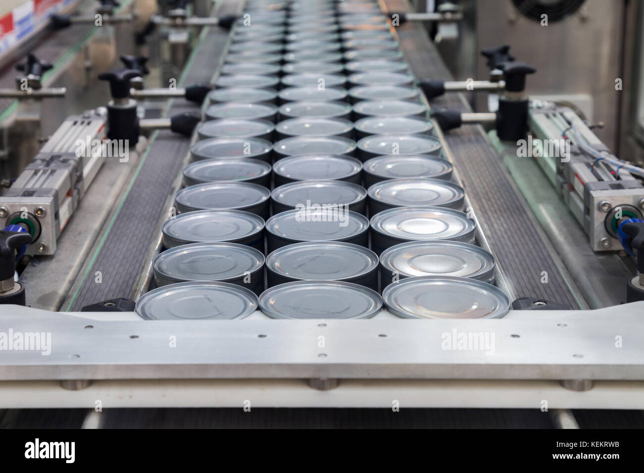 aluminum cans for food processed in factory line conveyor machine at ...