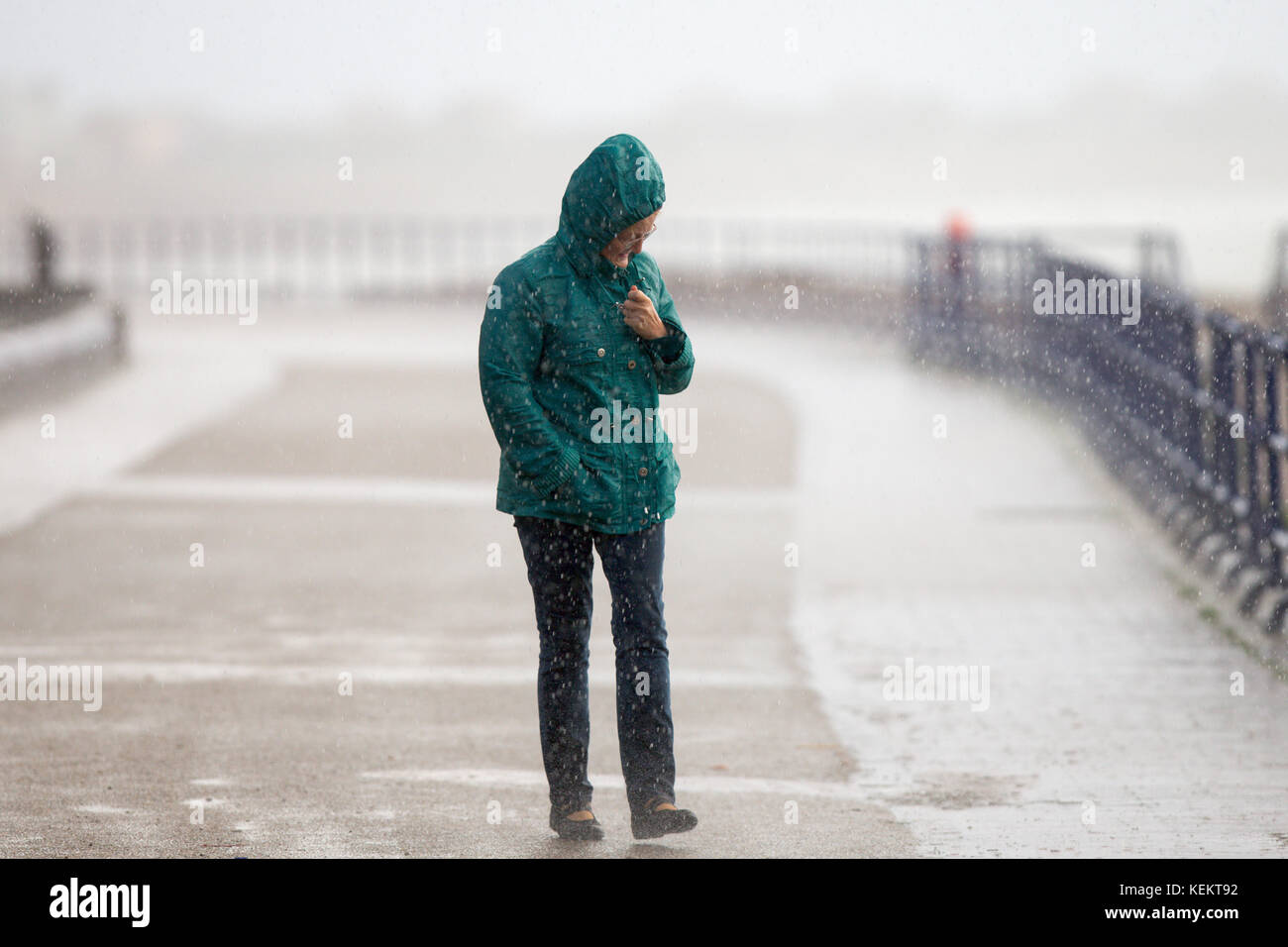 Women getting wet on Eastbourne Pier in Sussex on Saturday morning ...