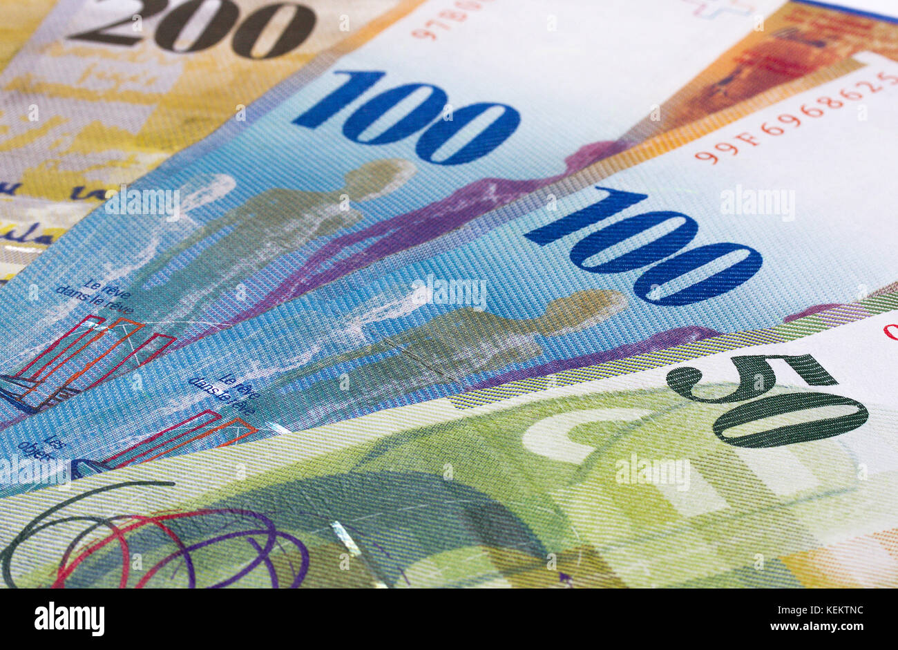 Swiss franc of different abstract money background Stock Photo - Alamy