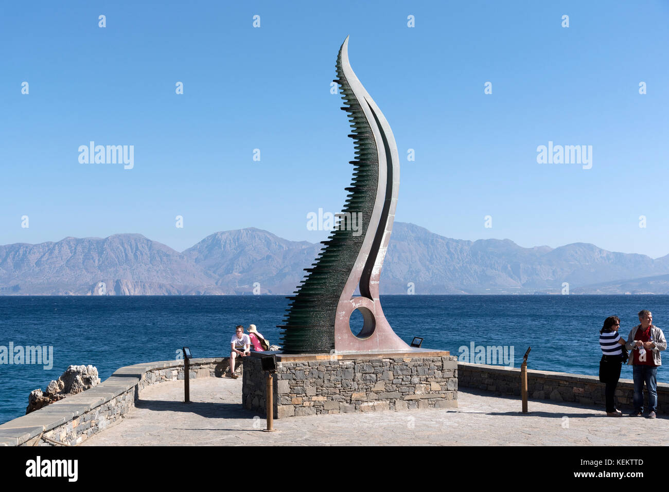 Port of Agios Nikolaos, Crete, Greece. The Amalthea's Horn sculpture on ...