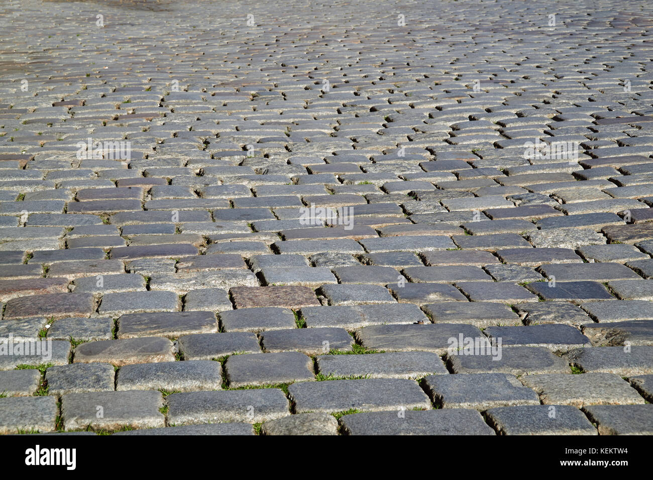 Granite paving the pavement on the market in Poznan Stock Photo - Alamy
