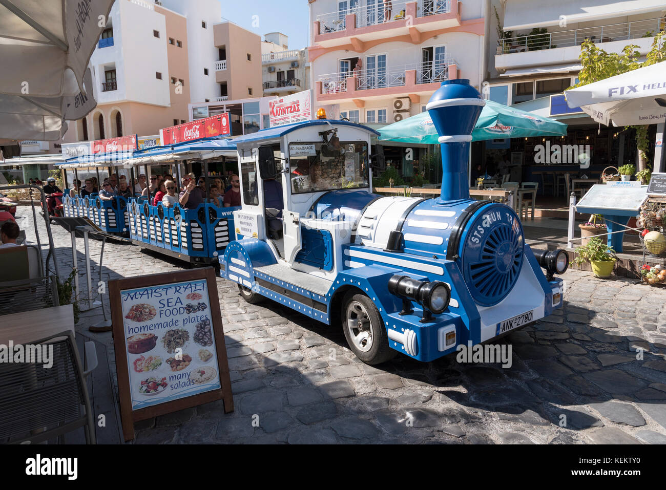 Agios Nikolaos, Crete, Greece. A tourist fun train taking visitors on a ...