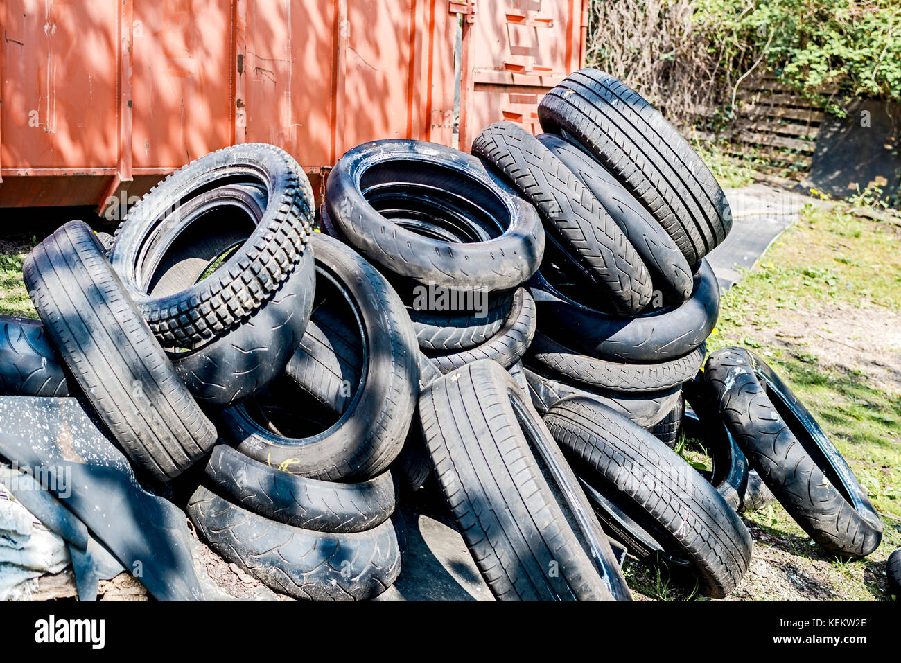 Pile of old Tyres in a shop Stock Photo - Alamy