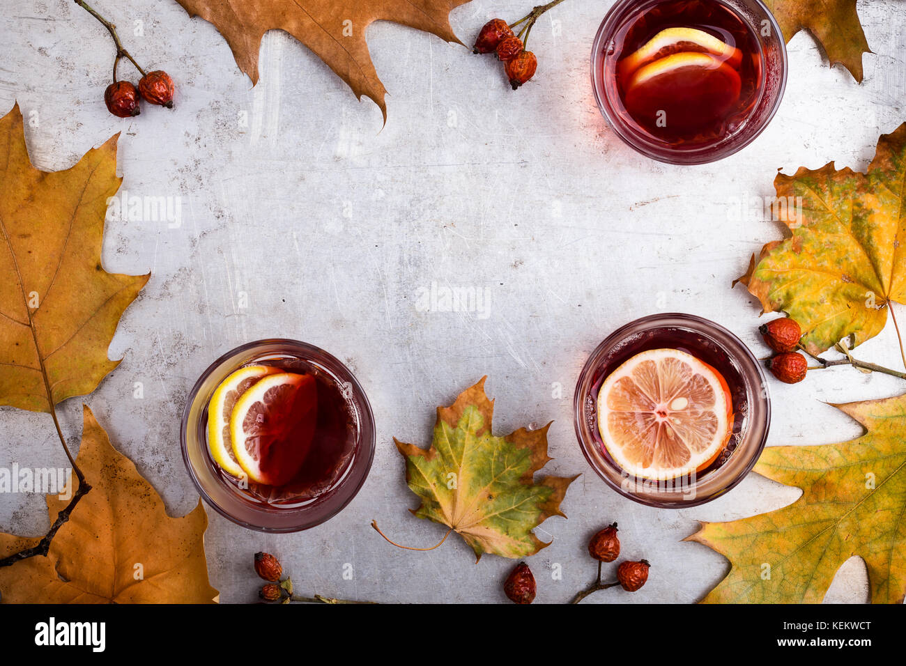 Hot red tea with lemon on light gray table with copy space viewed from ...