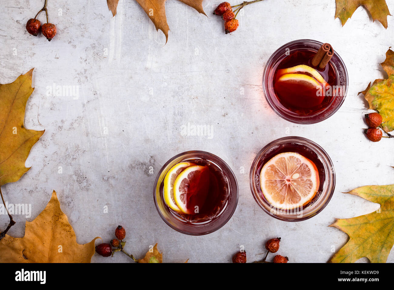 Hot red tea with lemon on light gray table with copy space viewed from ...