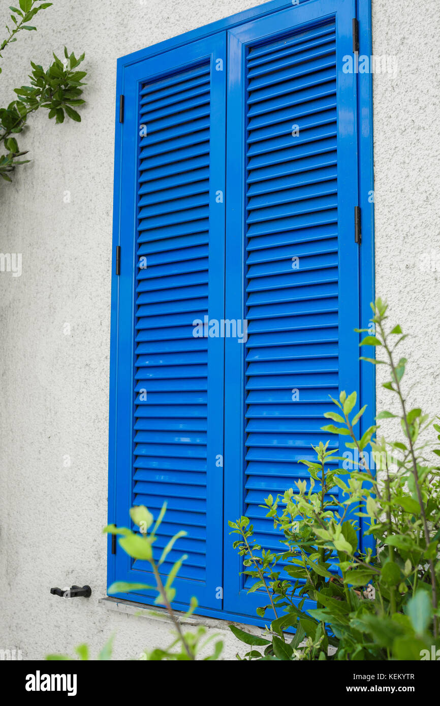 window with blue shutters Stock Photo - Alamy