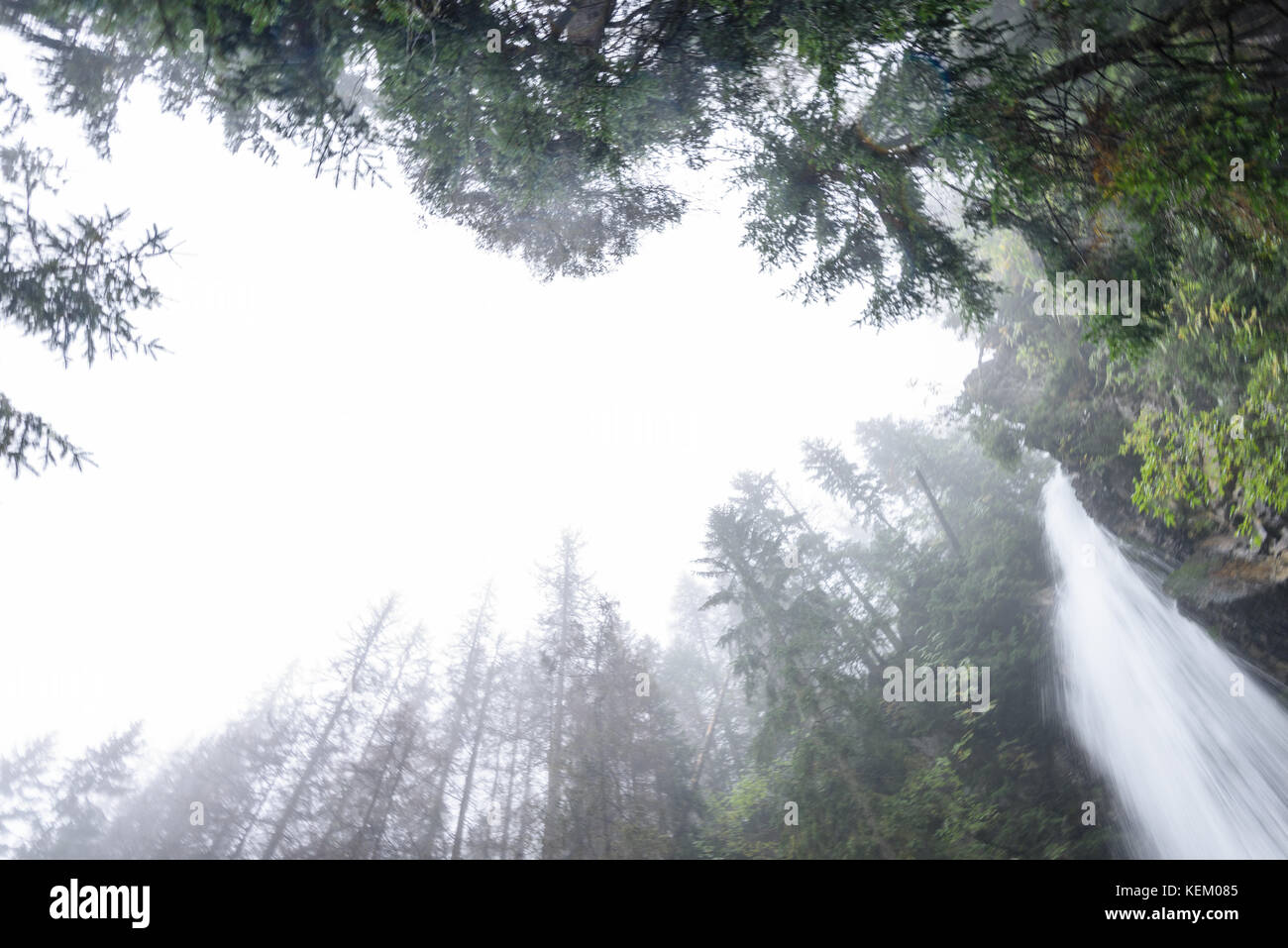 large Waterfall falling from sky in autumn, long exposure, in mountain ...
