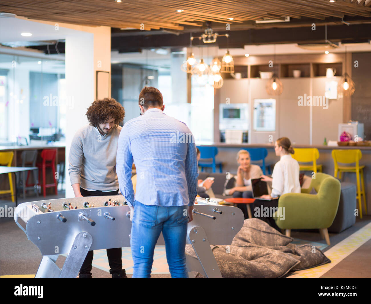 Startup Office People Enjoying Table Soccer Game During their Free Time ...