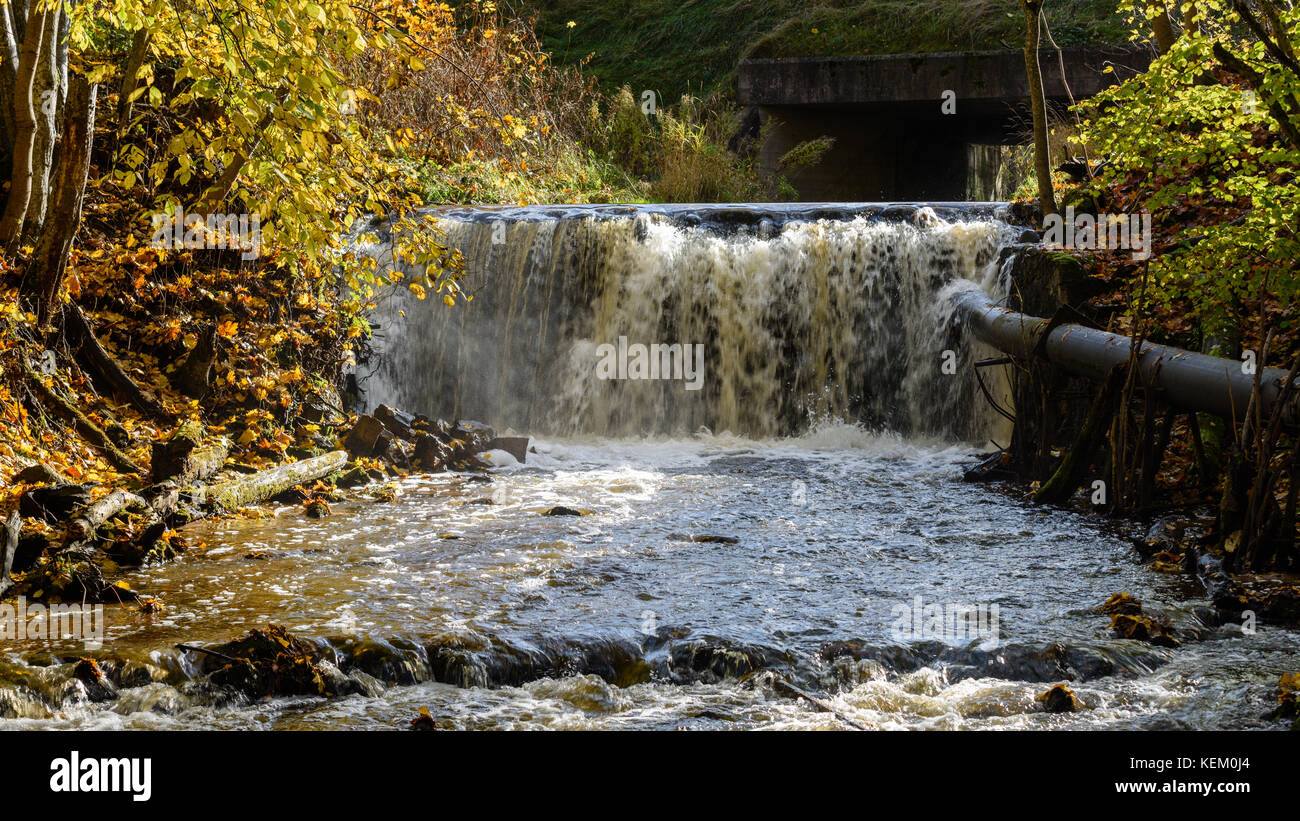 Waterfall from ravine in autumn, long exposure, in mountain river with ...