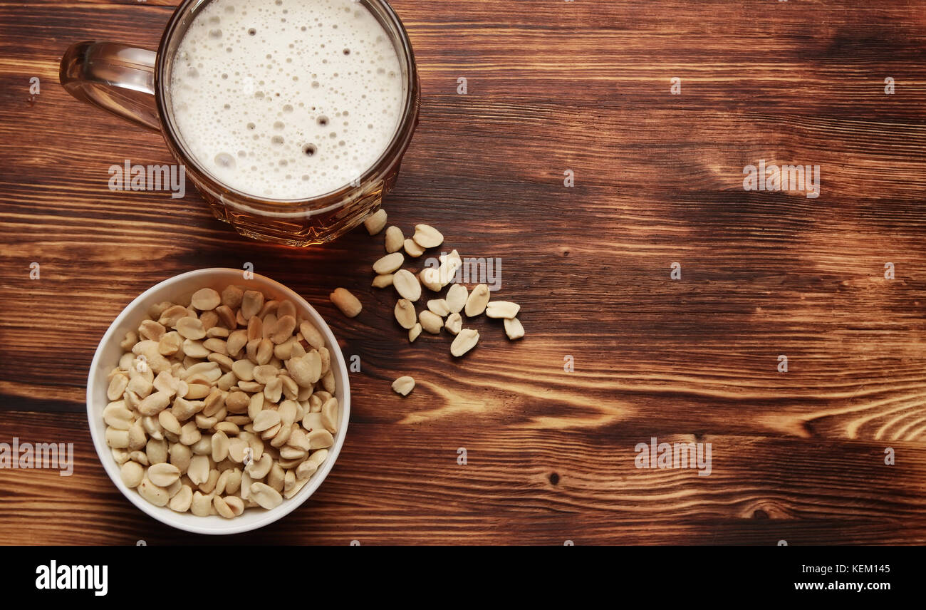 Beer in a mug and snack Stock Photo - Alamy