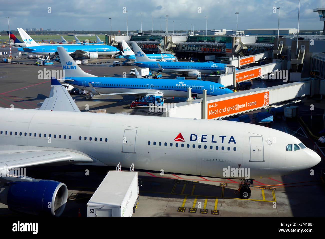 Delta and KLM aircraft on the runway awaiting departure at Amsterdam ...