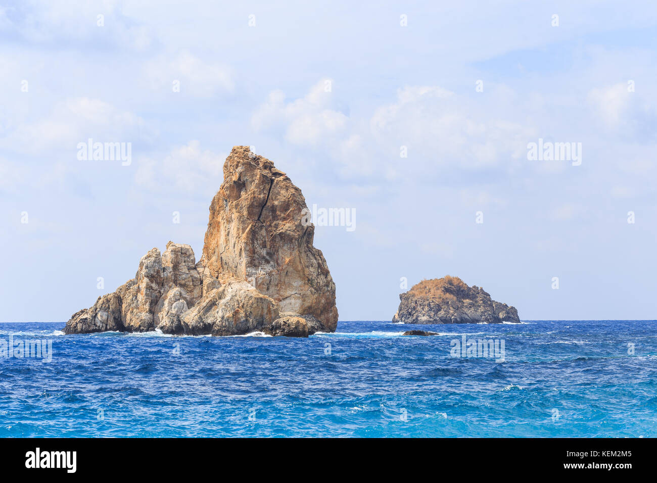 Seascape with rock islands in the water Stock Photo - Alamy