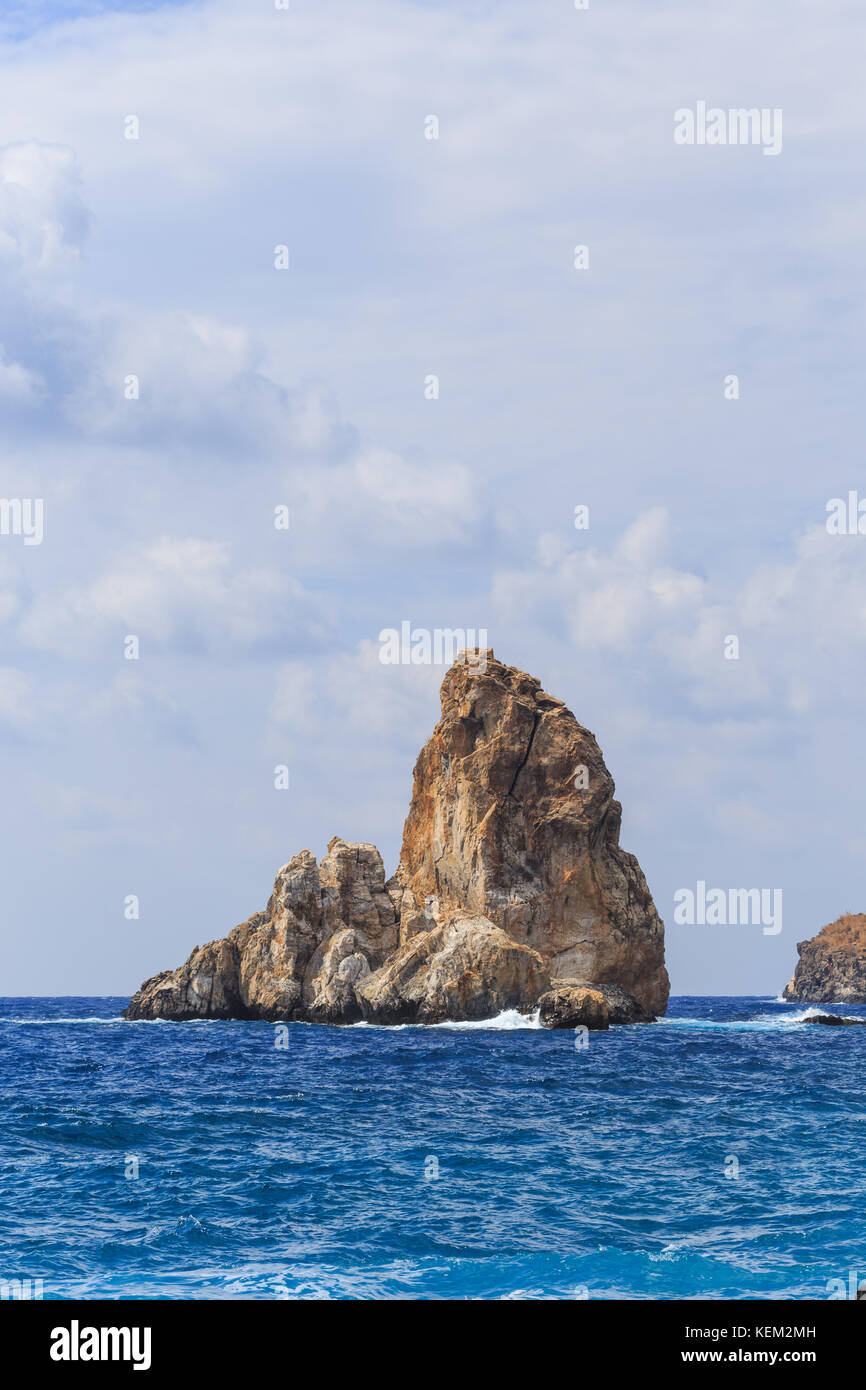 Seascape with rock island in the water Stock Photo - Alamy