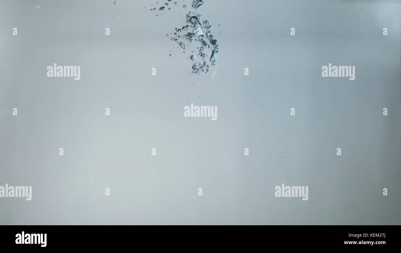 Close up water bubbles on glass gray background. Water bubbles in a ...