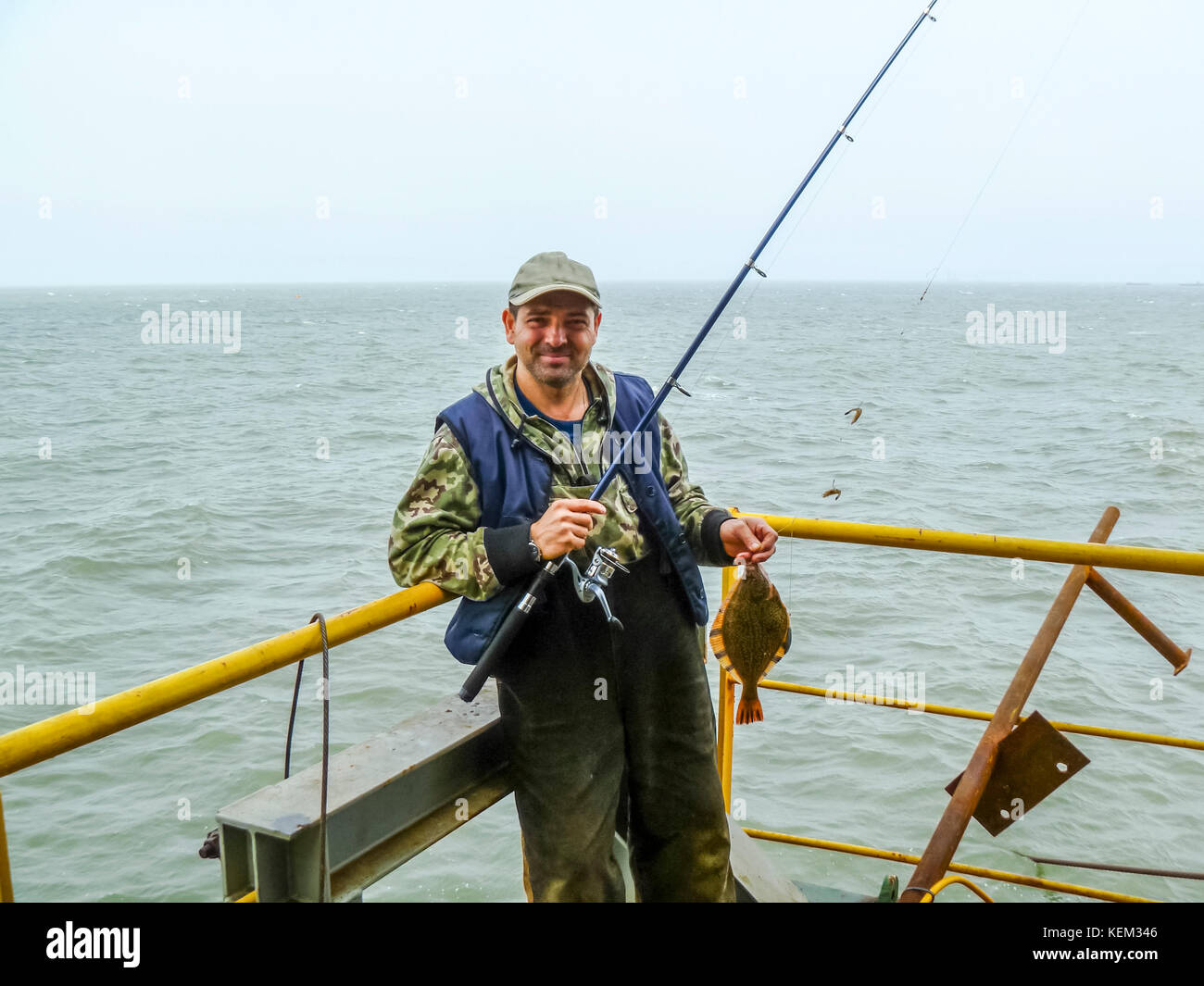 Flounder on the deck. Fishing on the boat. Bottom fish Stock Photo - Alamy