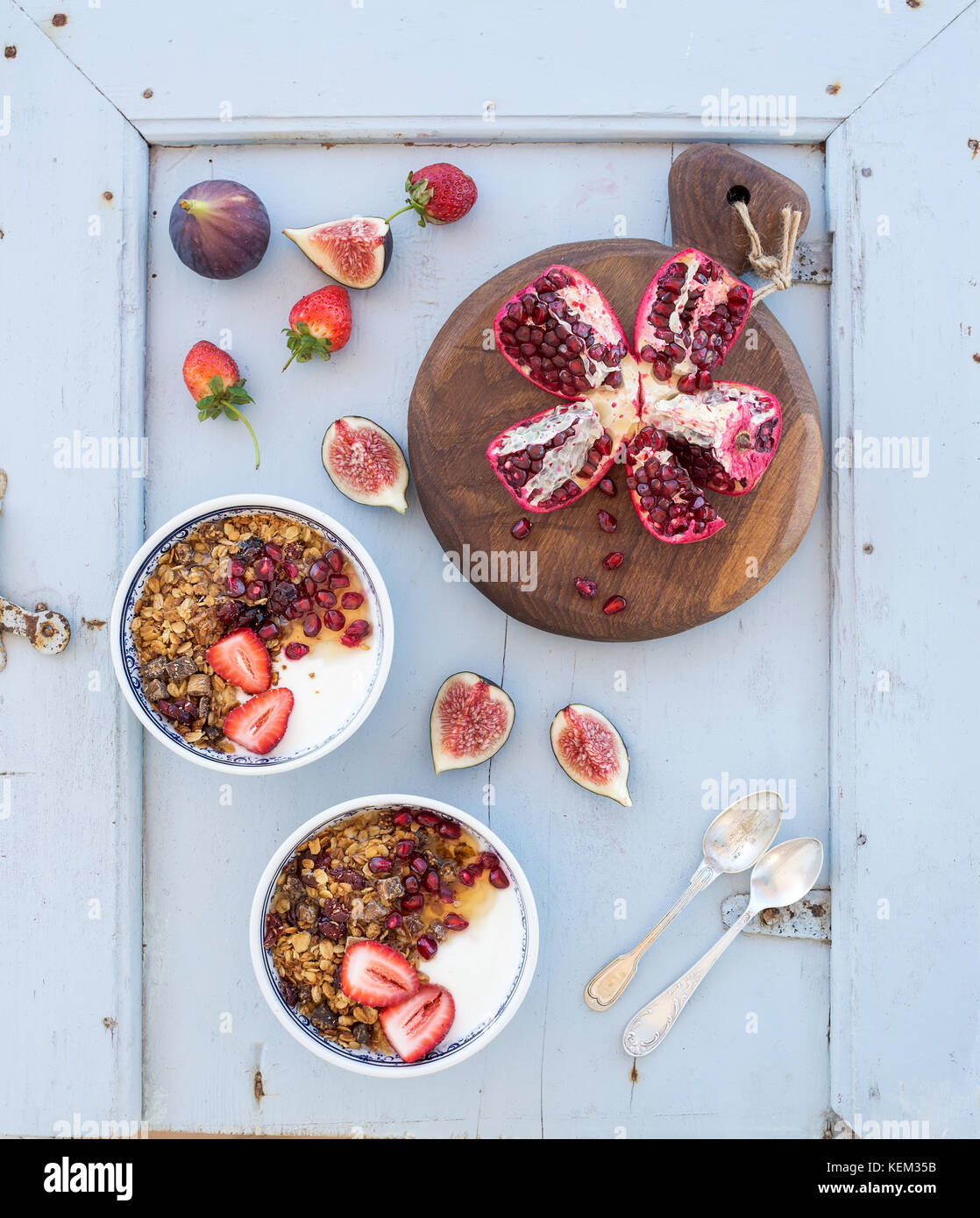 Healthy breakfast set. Bowls of oat granola with yogurt, fresh ...
