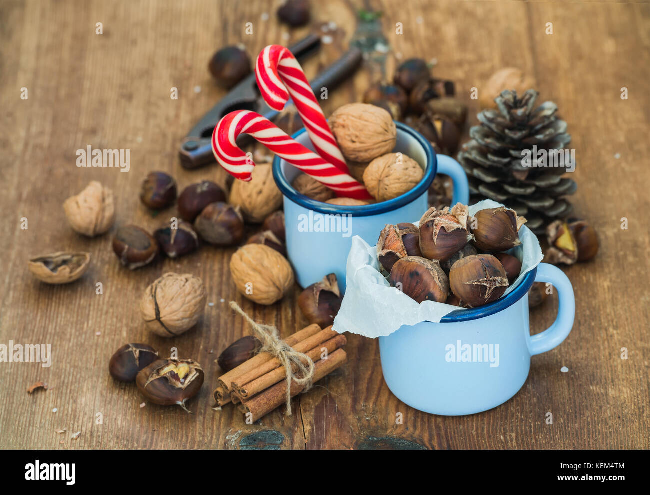 Traditional Christmas foods and decoration. Roasted chestnuts in blue ...