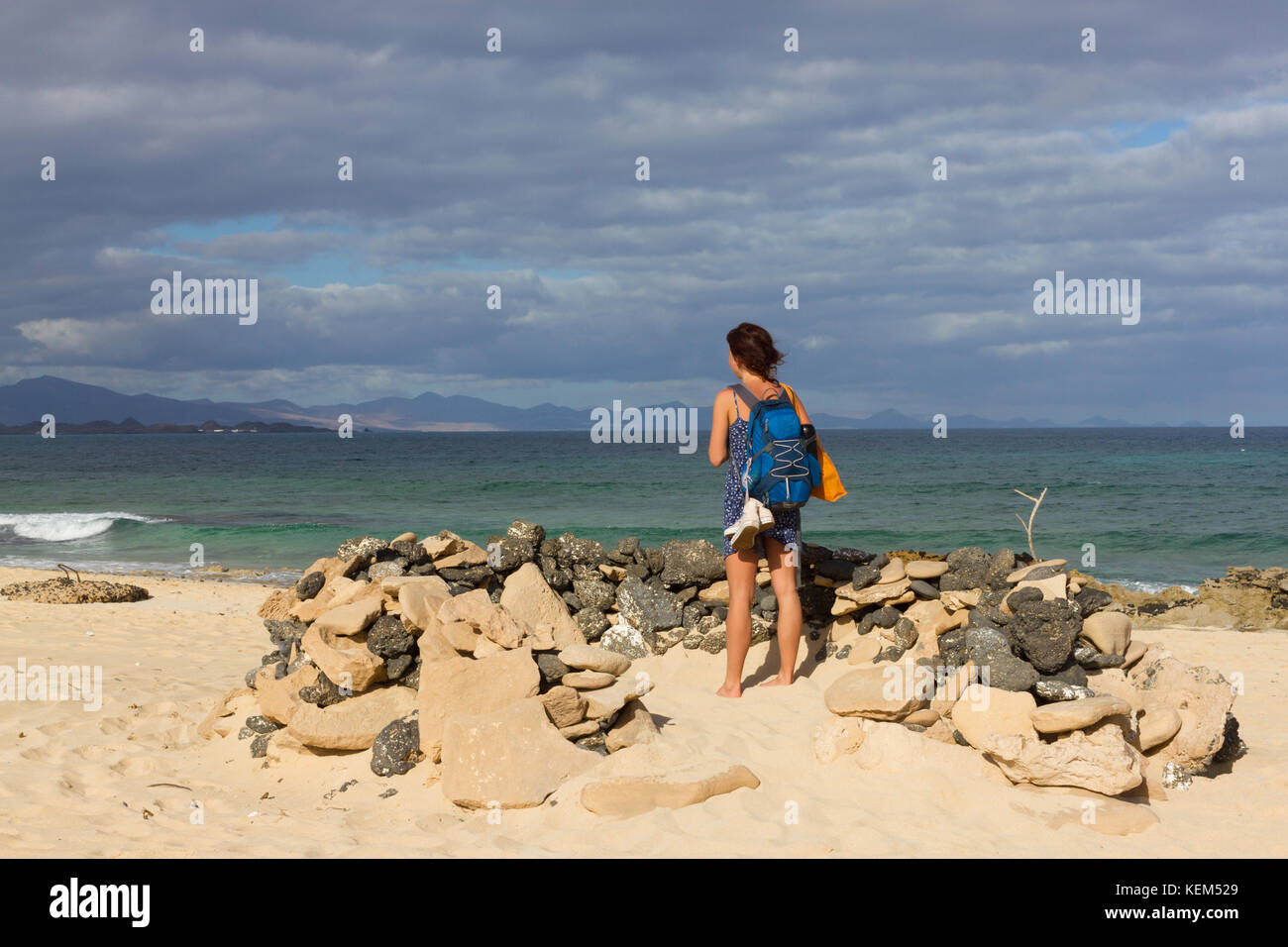 Girl is looking into the distance Atlantic ocean Stock Photo - Alamy