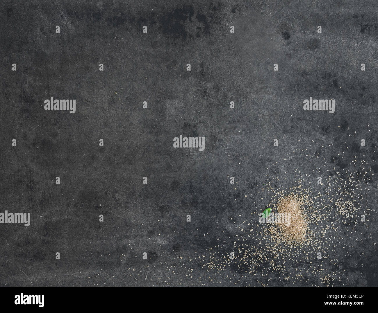 Dark grey grunge cooking backdrop with brown sugar and mint leaf Stock ...