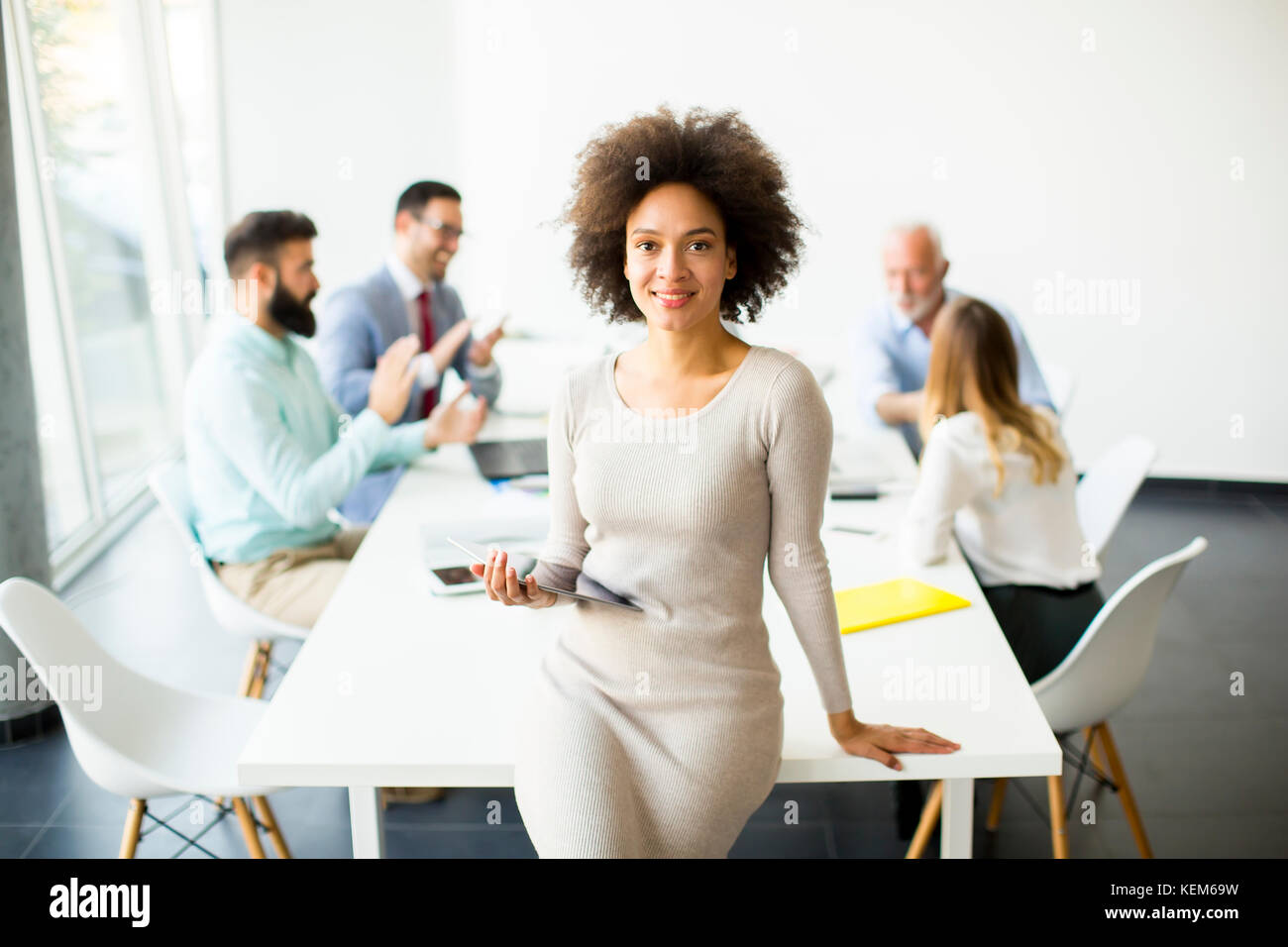 Typical business day at a modern company with multiethnic group of ...
