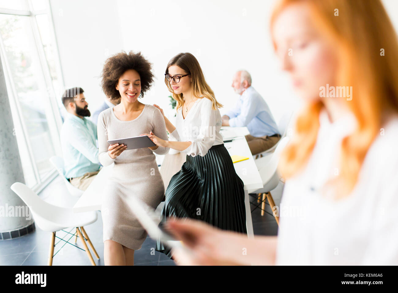 Typical business day at a modern company with multiethnic group of ...