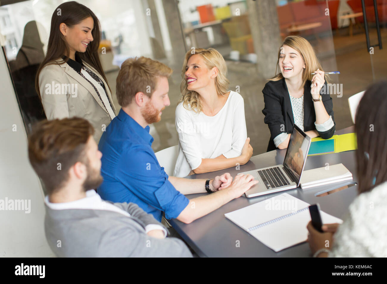 Business team working together in modern office to achieve better ...