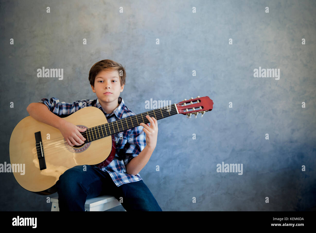 Teen play instrument hi-res stock photography and images - Alamy