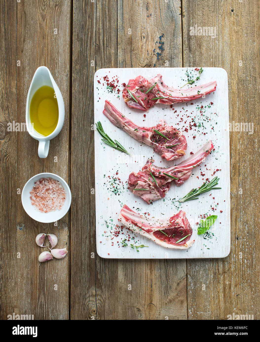 Raw lamb chops. Rack of Lamb with garlic, rosemary and spices on white ...