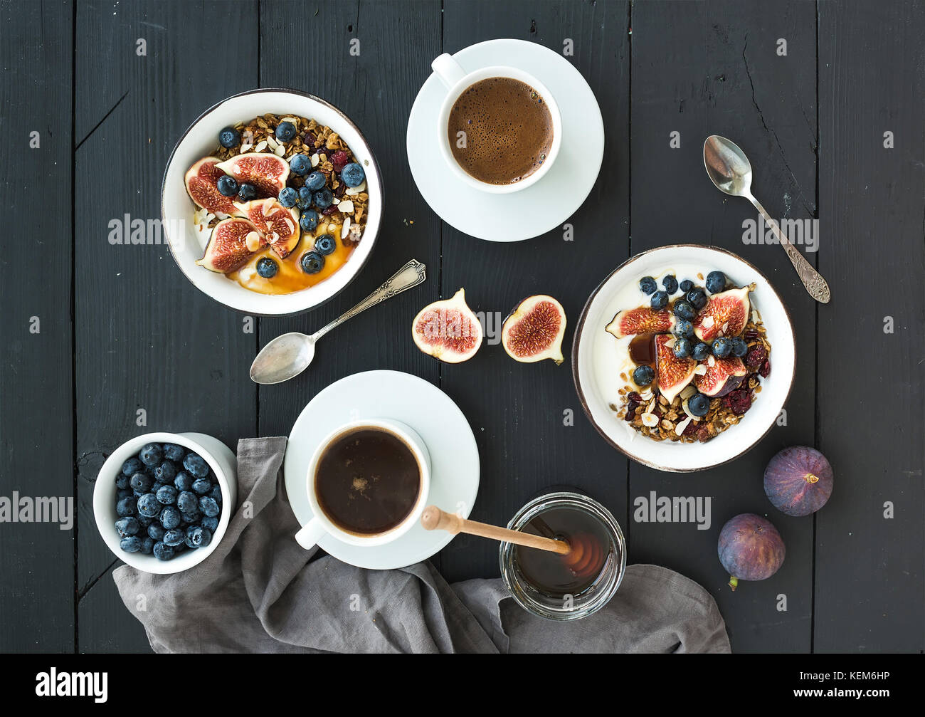 Healthy breakfast set. Bowls of oat granola with yogurt, fresh ...