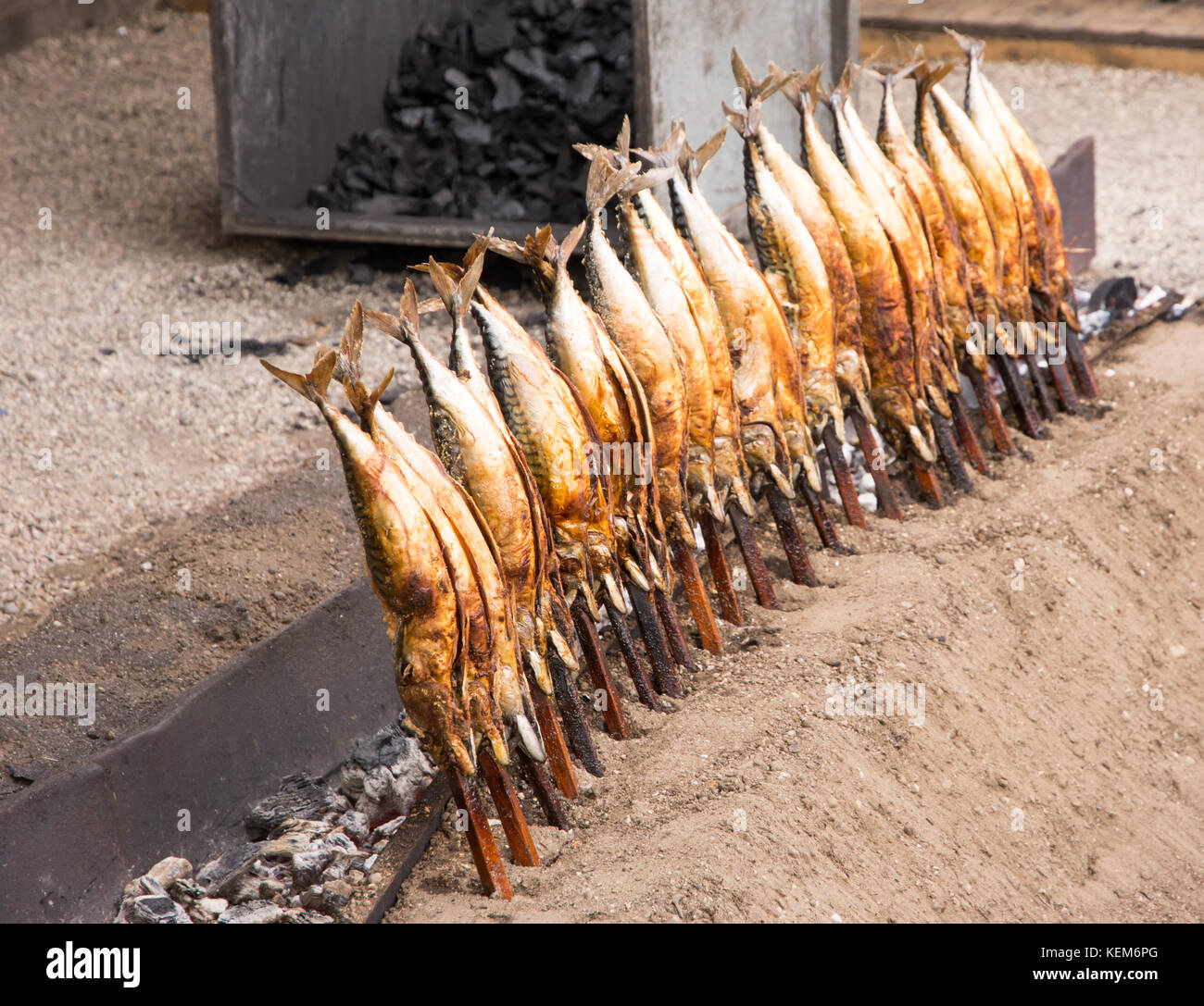 Steckerlfisch fish grilled on a stick at the oktoberfest hi-res stock ...
