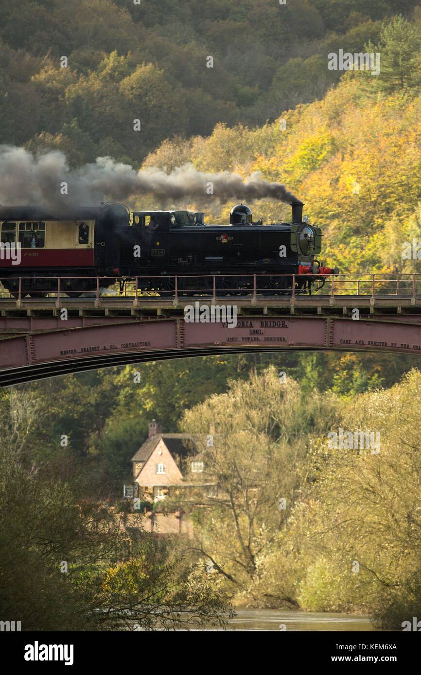 A steam engine train crosses over the Victoria Bridge on the Severn ...