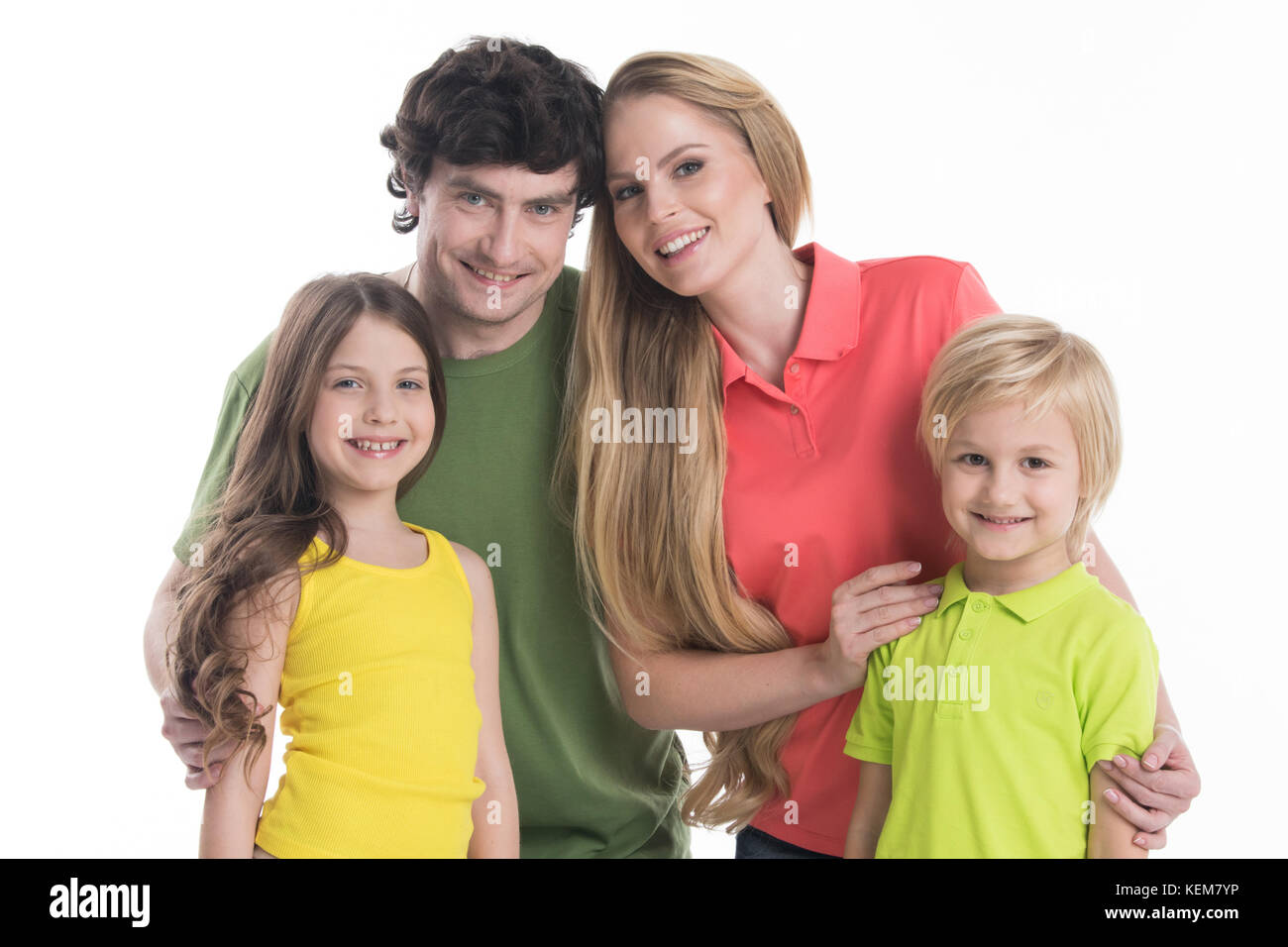 Happy smiling family of two parents and two children isolated on white ...