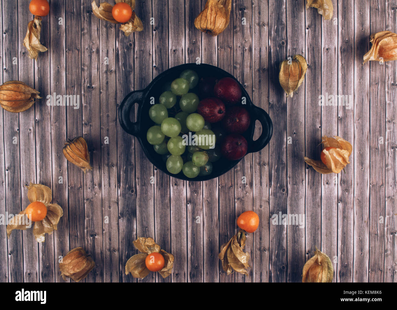Fresh juicy group of organic physalis, green grapes and gooseberries in ...