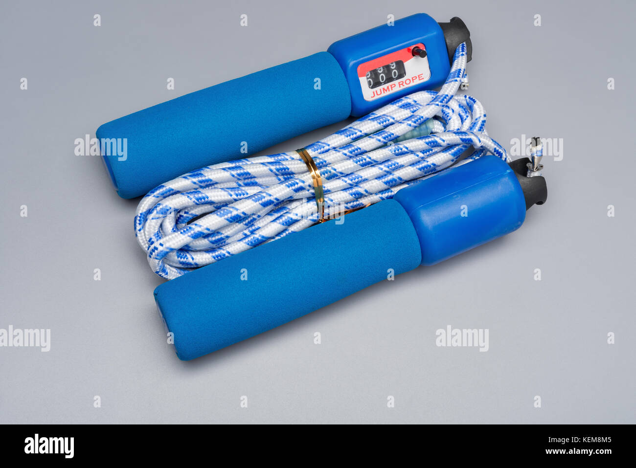 blue skipping rope with counter on grey background Stock Photo - Alamy