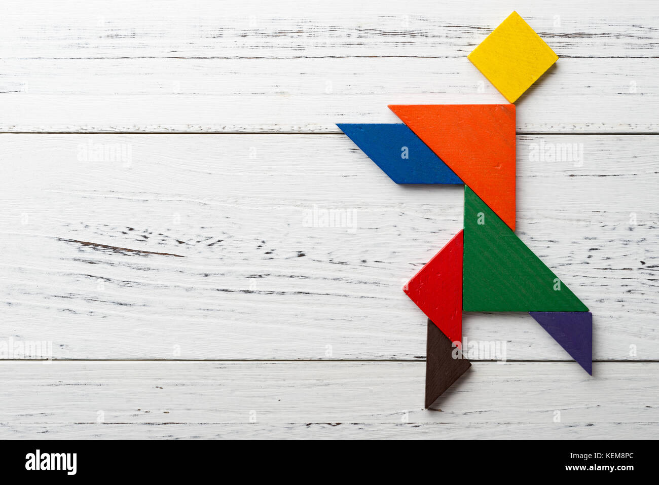 wooden tangram in a dancing people shape with copy space Stock Photo ...
