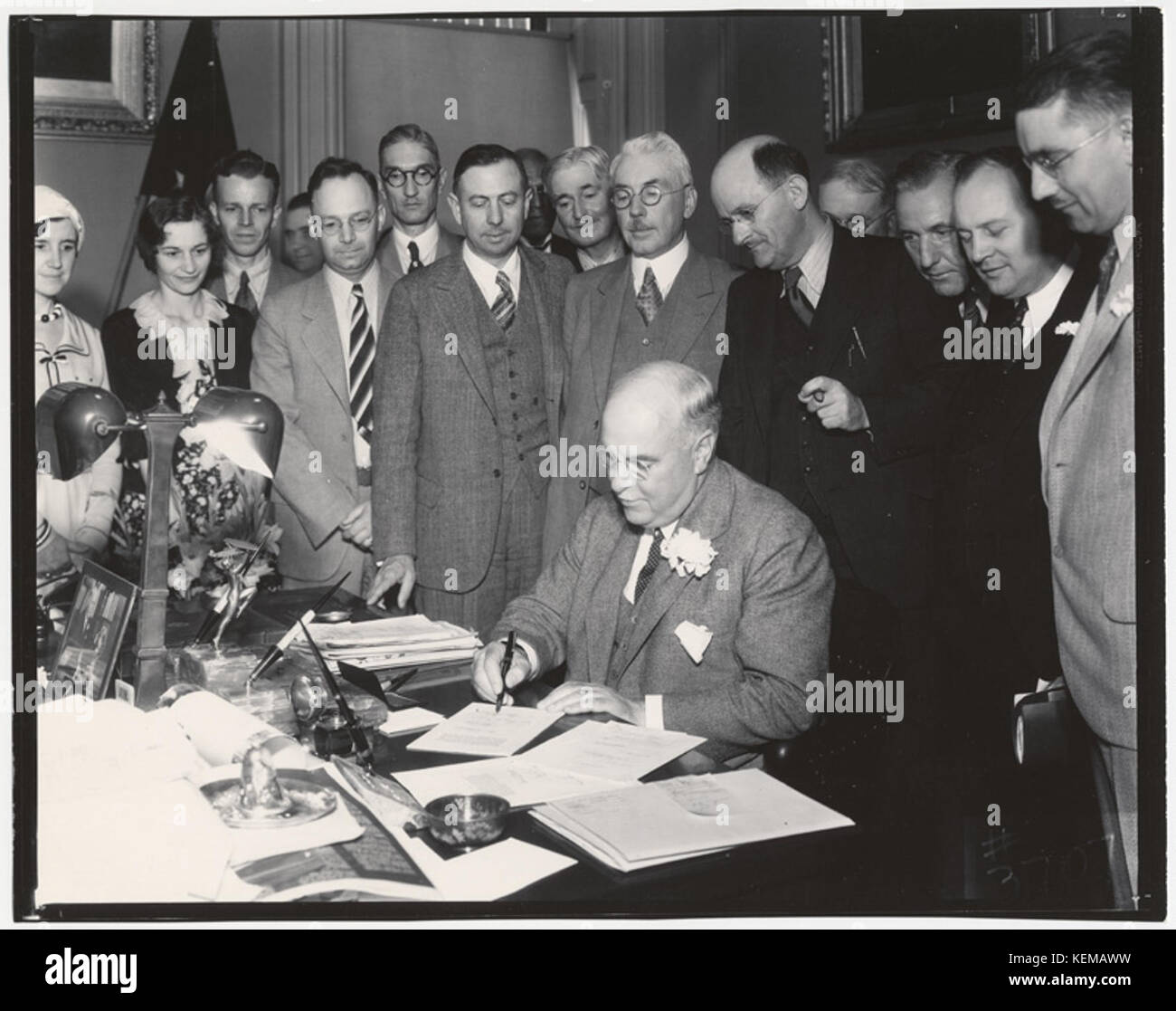 James Rolph, a prominent political figure, is captured signing an ...