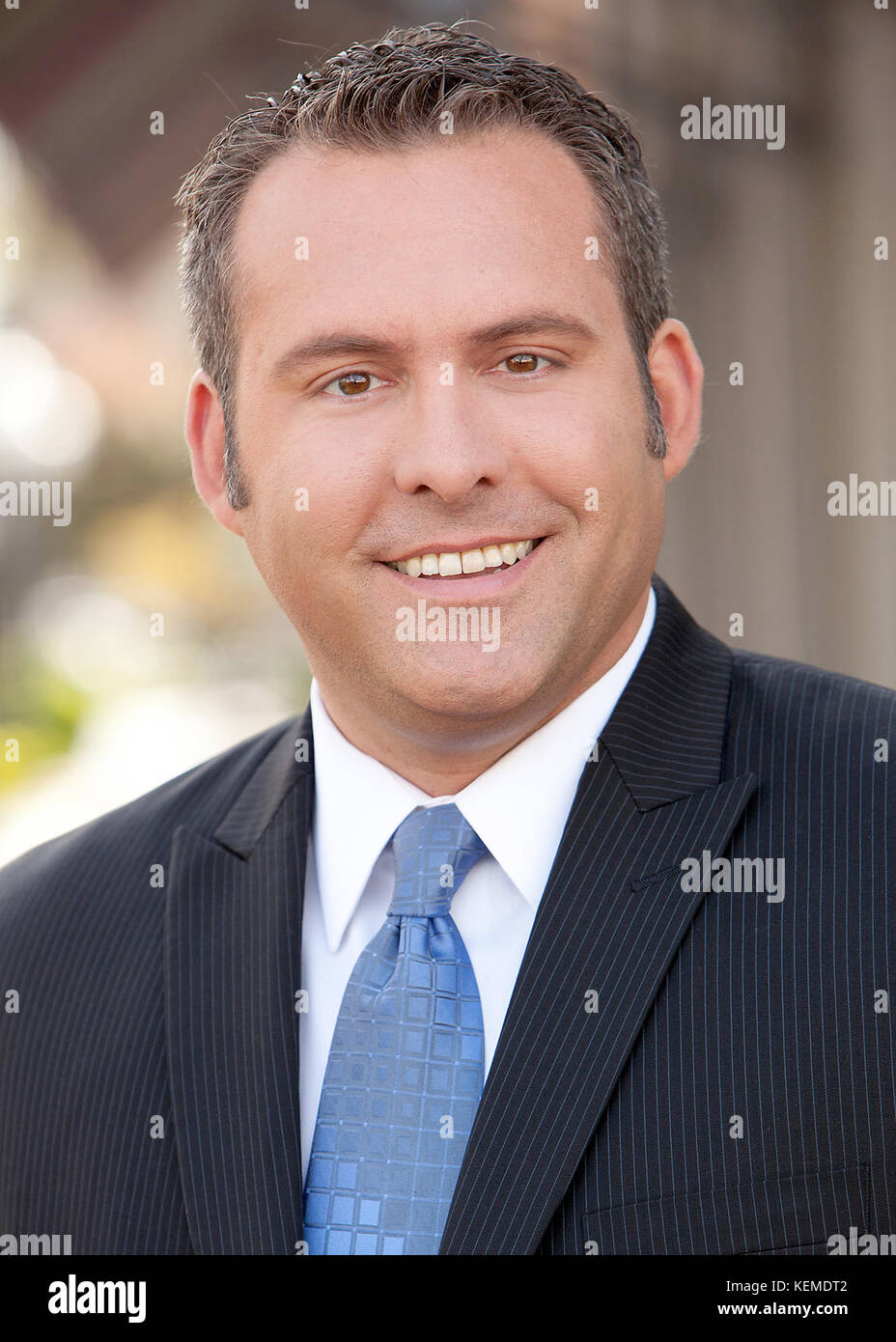 A simple gray headshot, potentially of an individual in a neutral pose ...