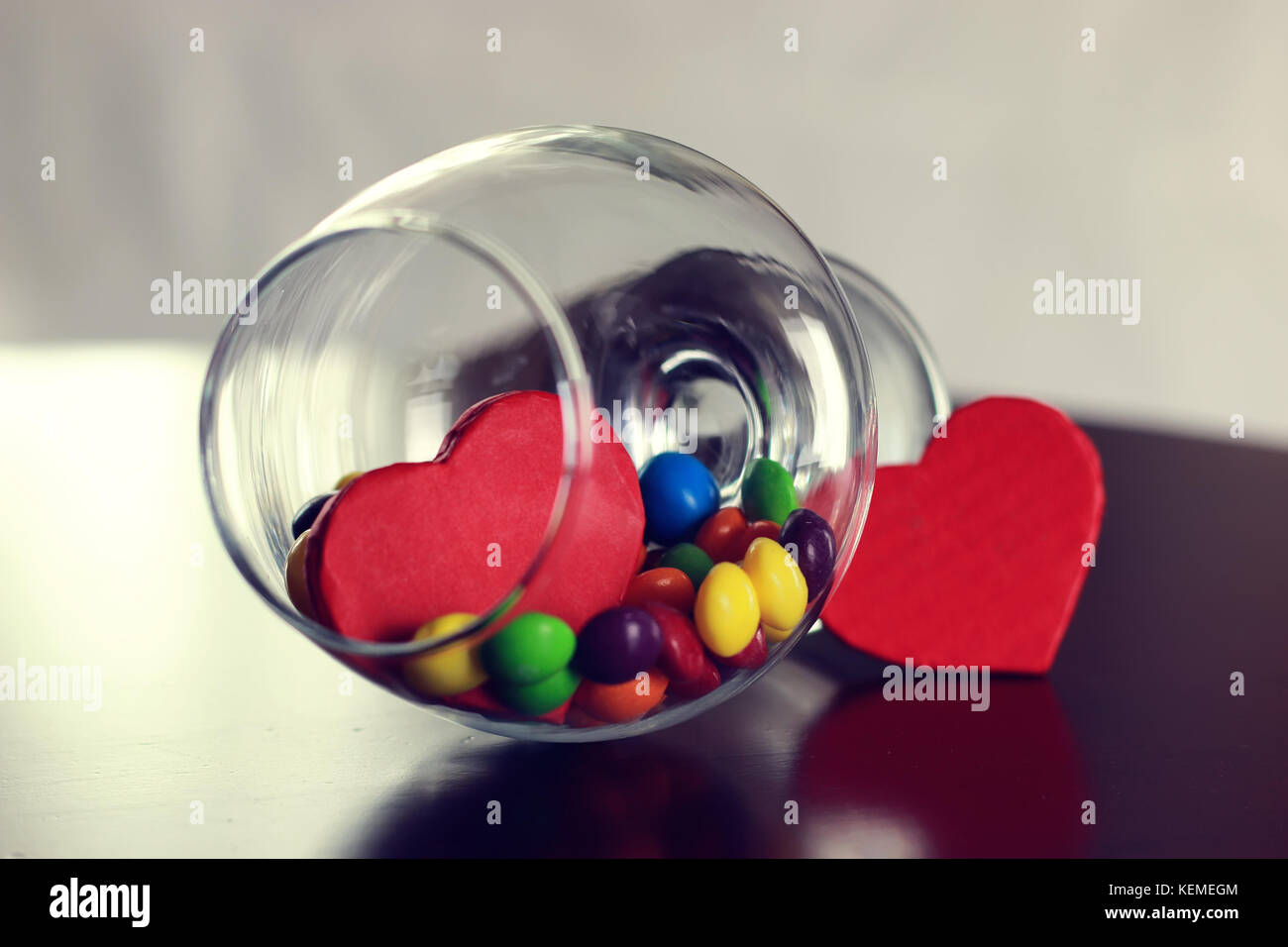 glass with candy pill Stock Photo - Alamy
