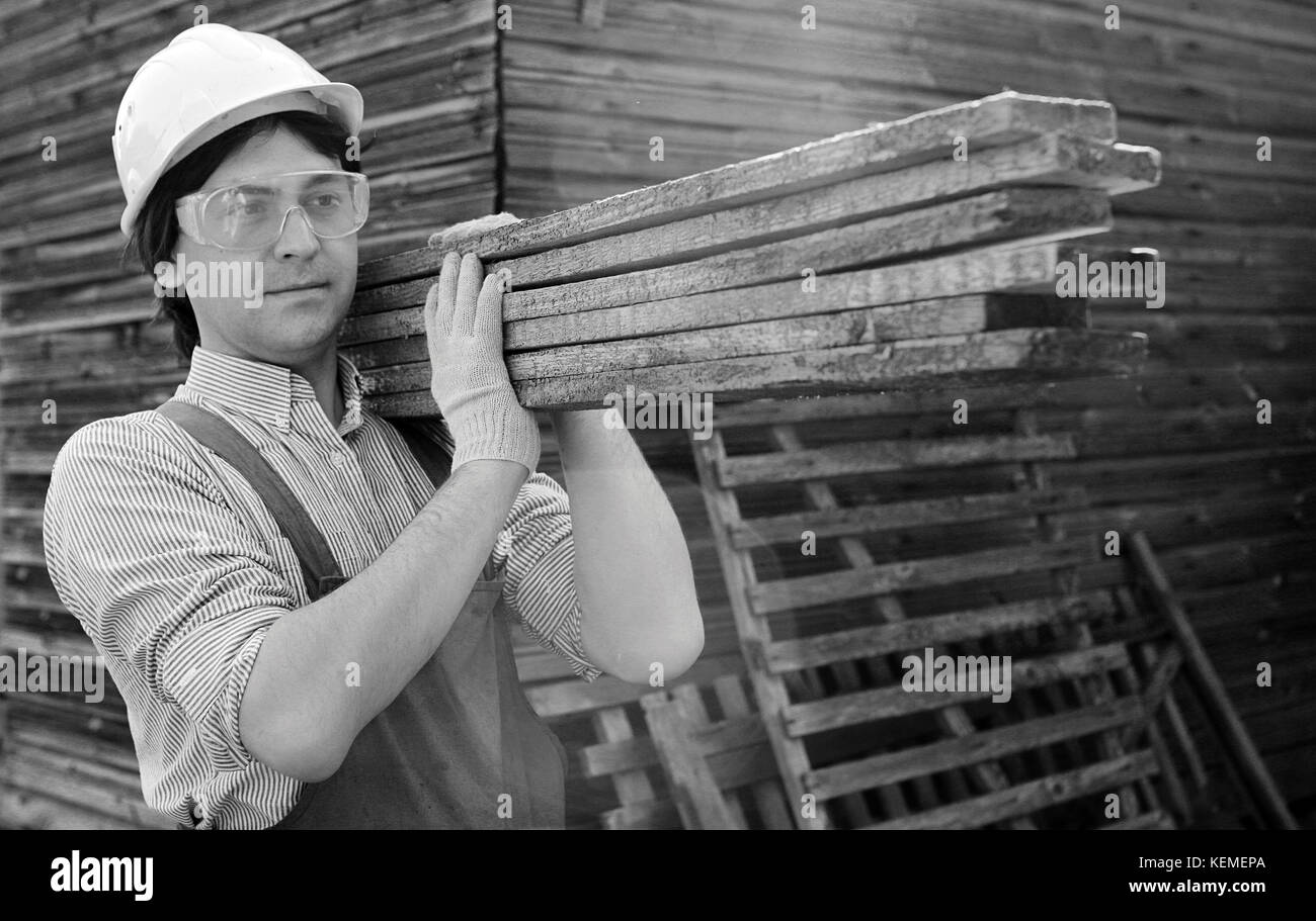 man in worker's clothes black and white Stock Photo - Alamy