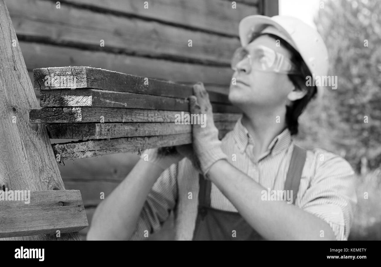 Construction workers house wall Black and White Stock Photos & Images ...