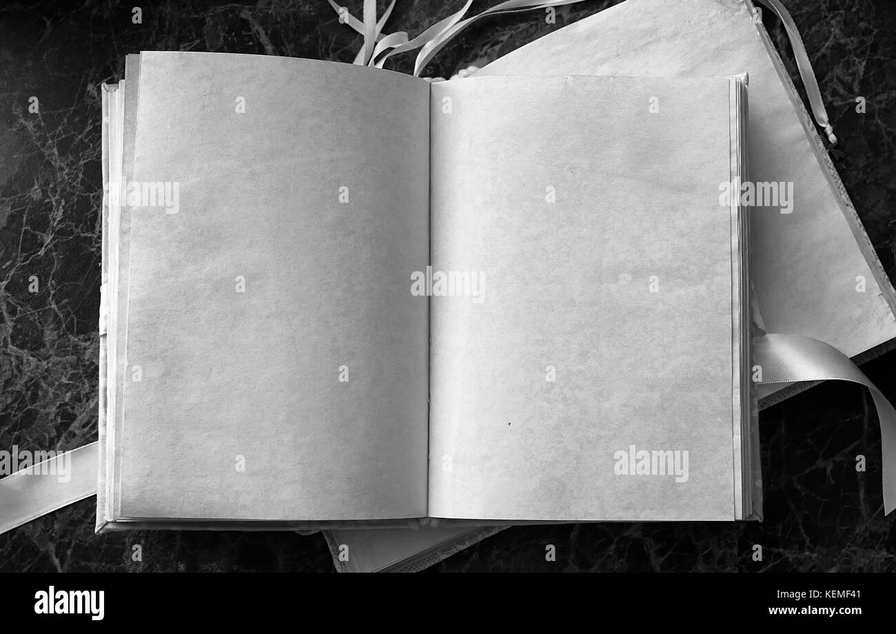 blank pages opened vintage book on the table Stock Photo - Alamy