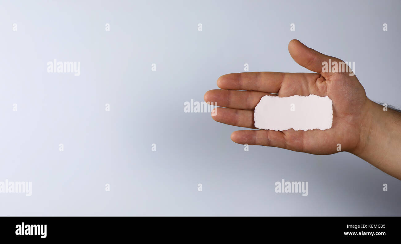 small white piece of paper in his hand man Stock Photo - Alamy