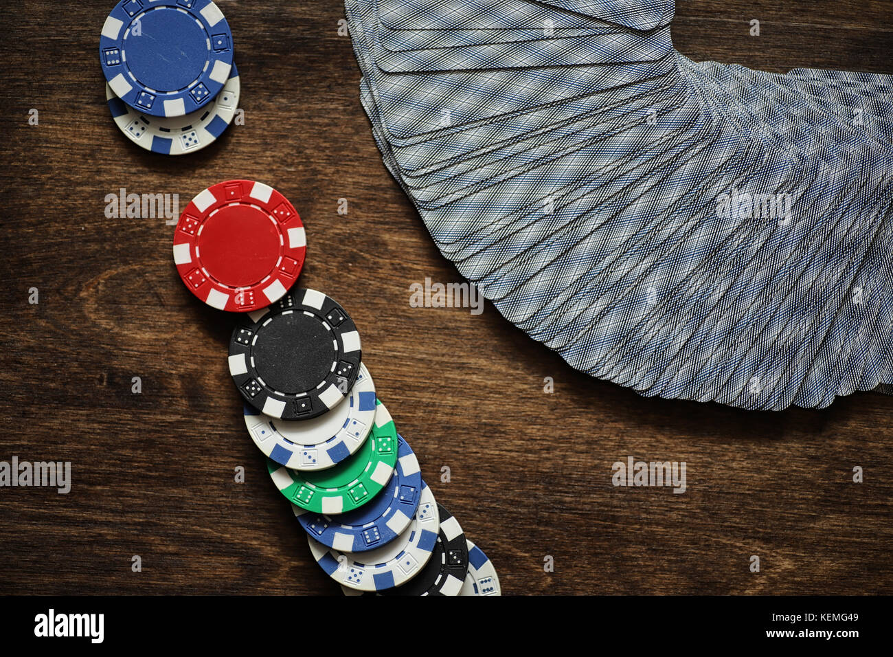 Playing chips and a deck of cards Stock Photo - Alamy