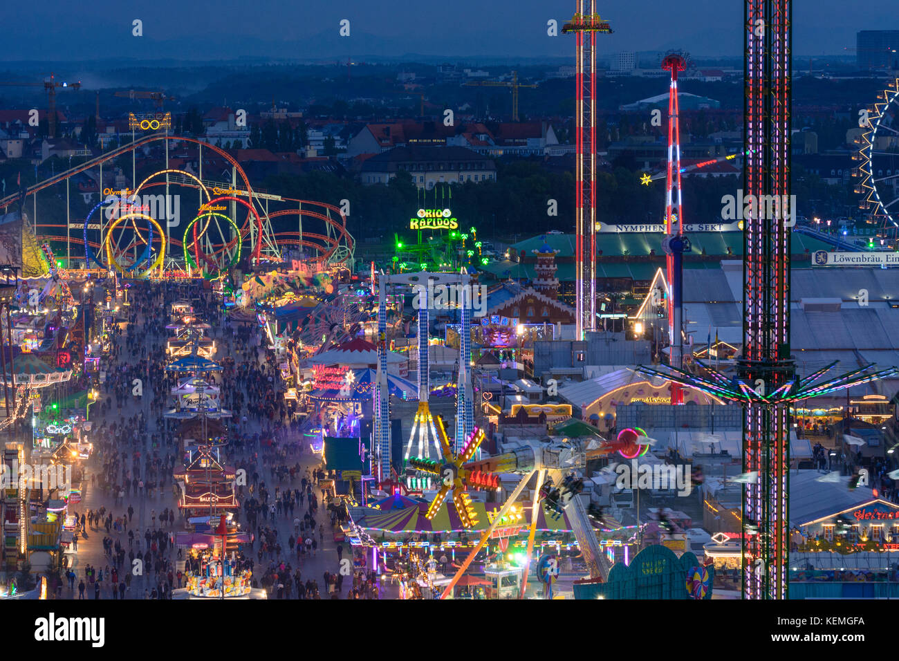 Oktoberfest beer festival: view, beer tent, rides, roller coaster ...